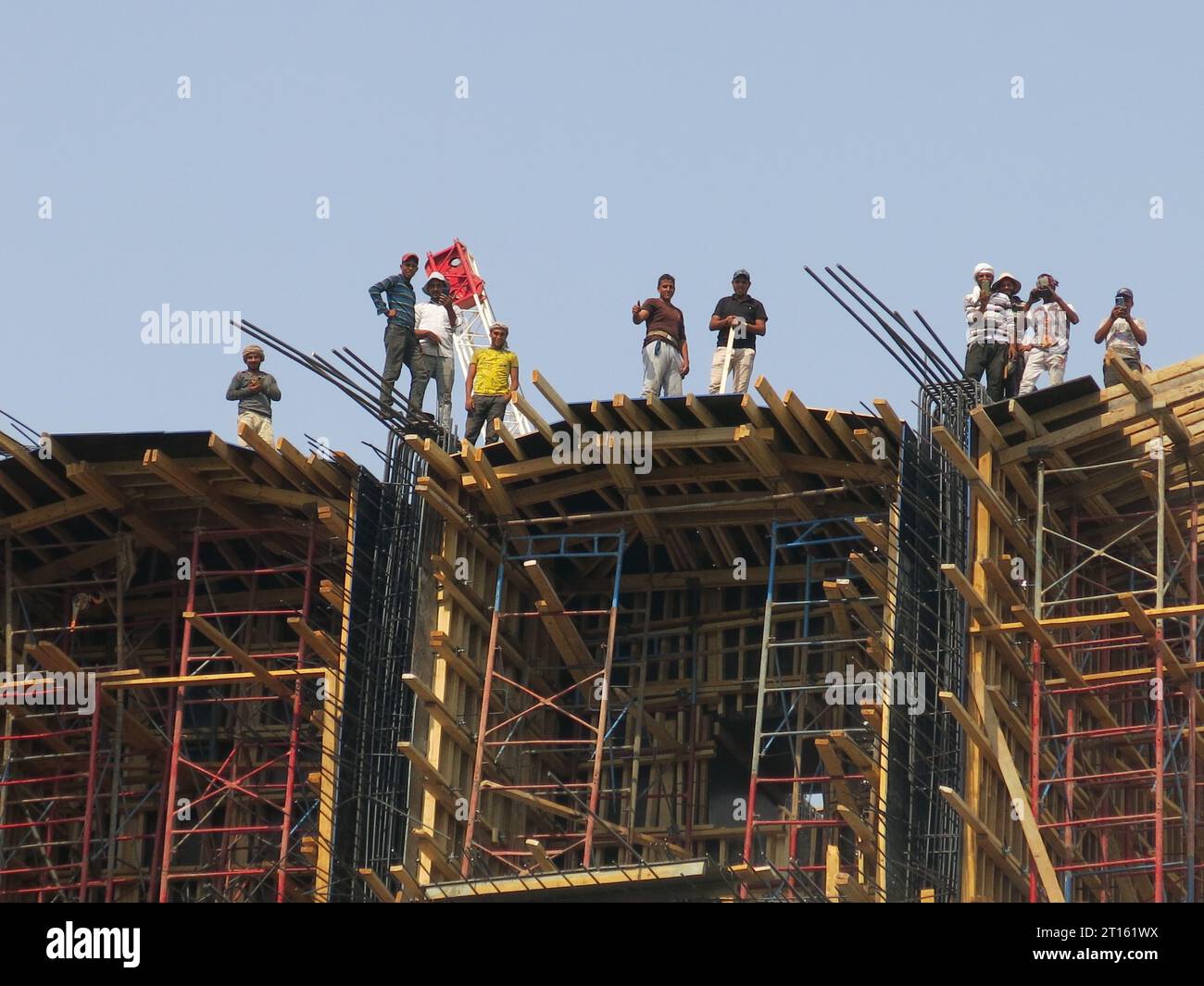View of workmen on top of a massive structure that's part of the new ...