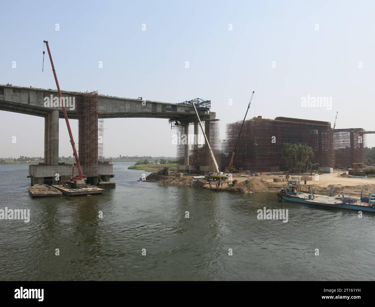 A new, massive bridge construction is underway at Manfalut to connect ...