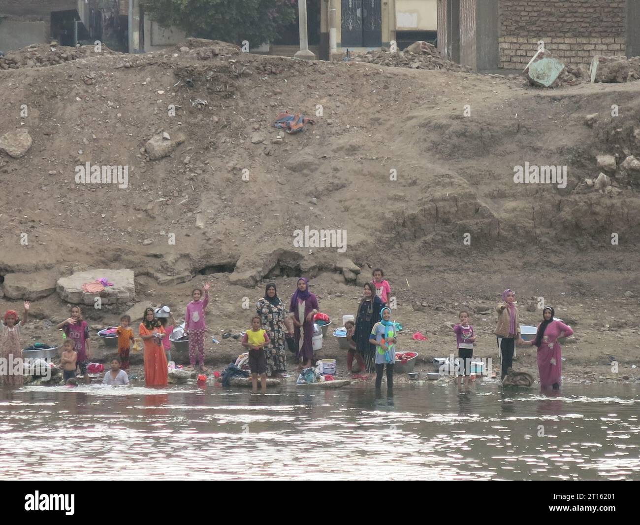Timeless scenes of family life on the banks of the River Nile: group of ...