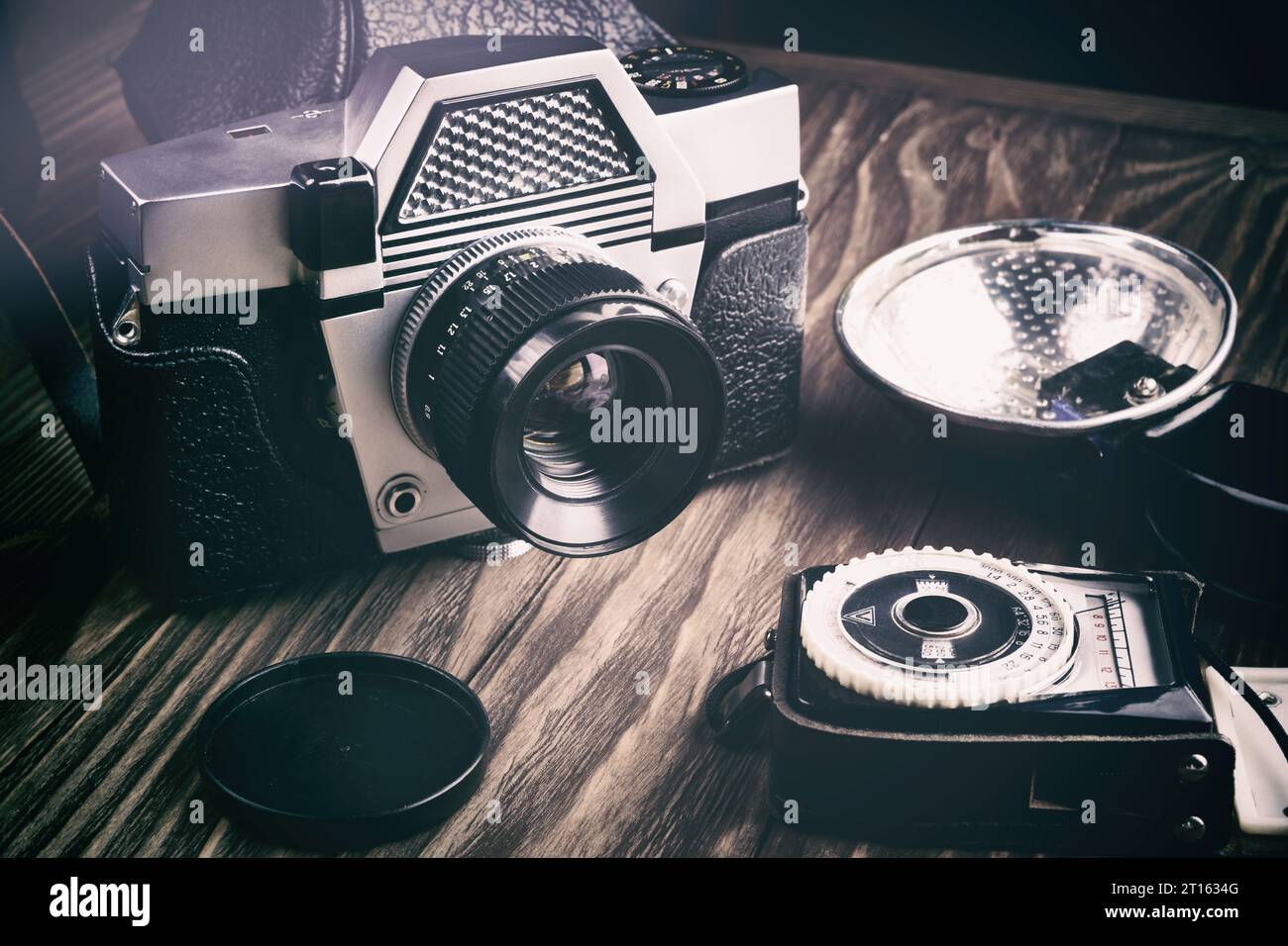 Old vintage film photo camera, flash and exposure meter Stock Photo - Alamy
