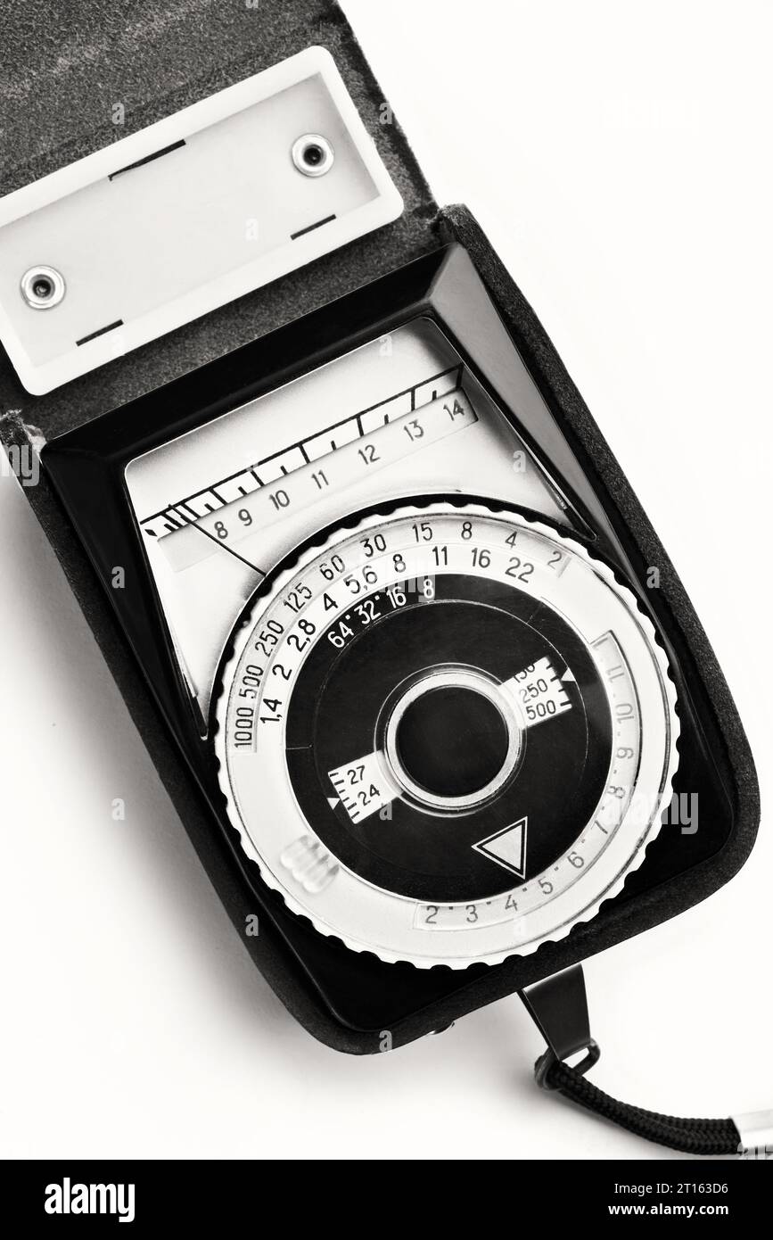 Old vintage photo exposure meter isolated white Stock Photo - Alamy