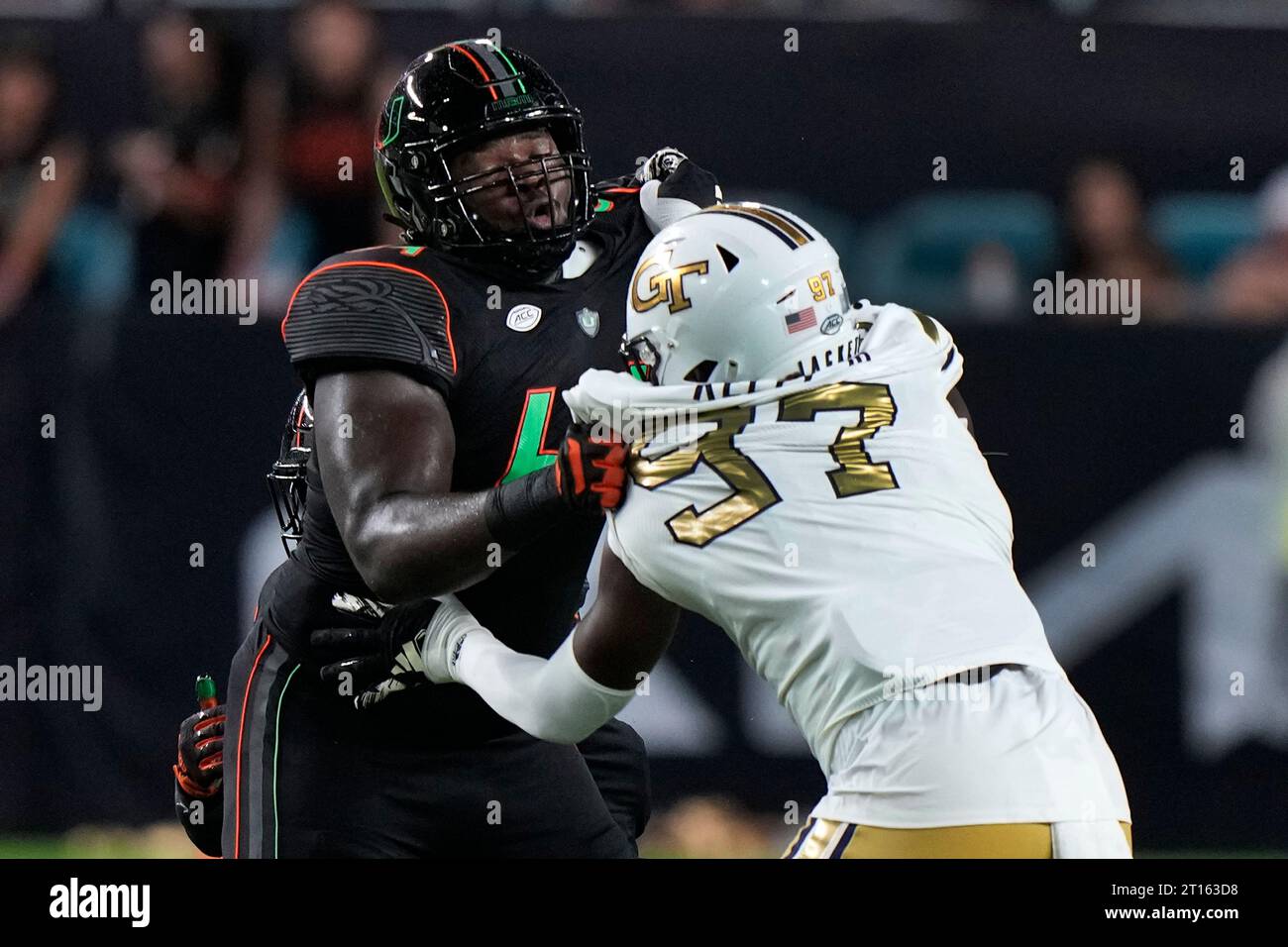 Miami offensive lineman Jalen Rivers, left, and Georgia Tech defensive ...