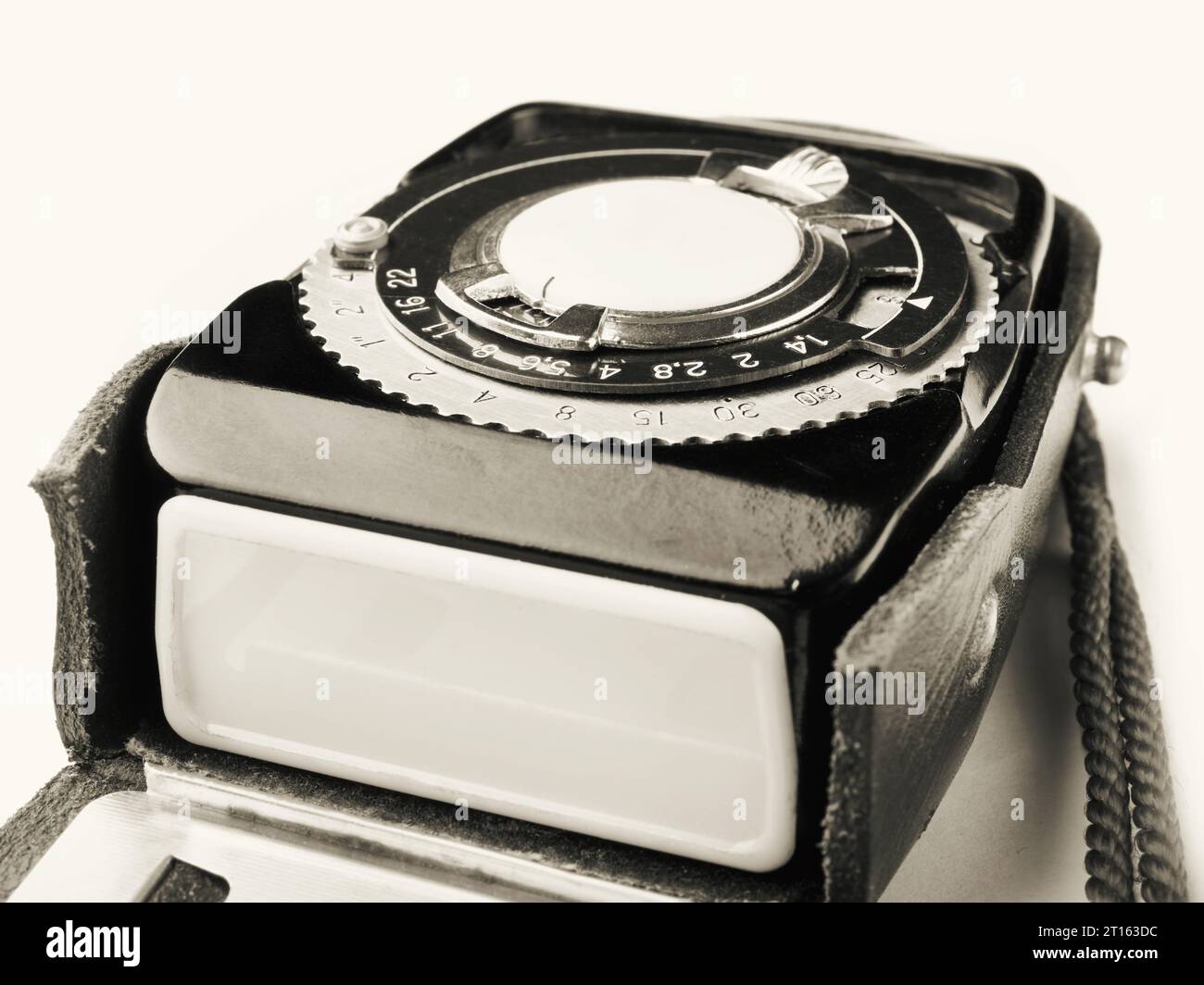 Old vintage photo exposure meter on white Stock Photo - Alamy