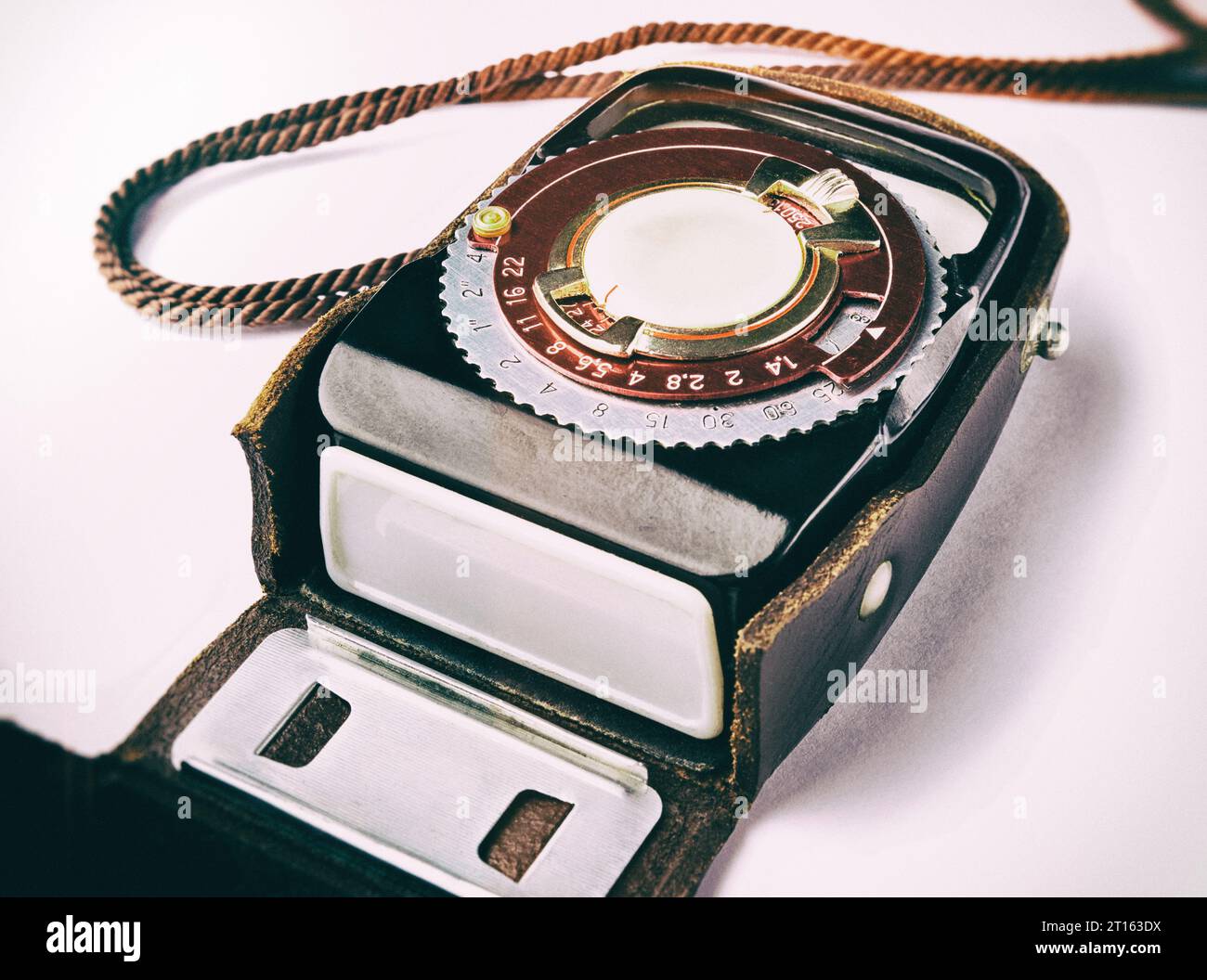 Old vintage photo exposure meter on white Stock Photo - Alamy