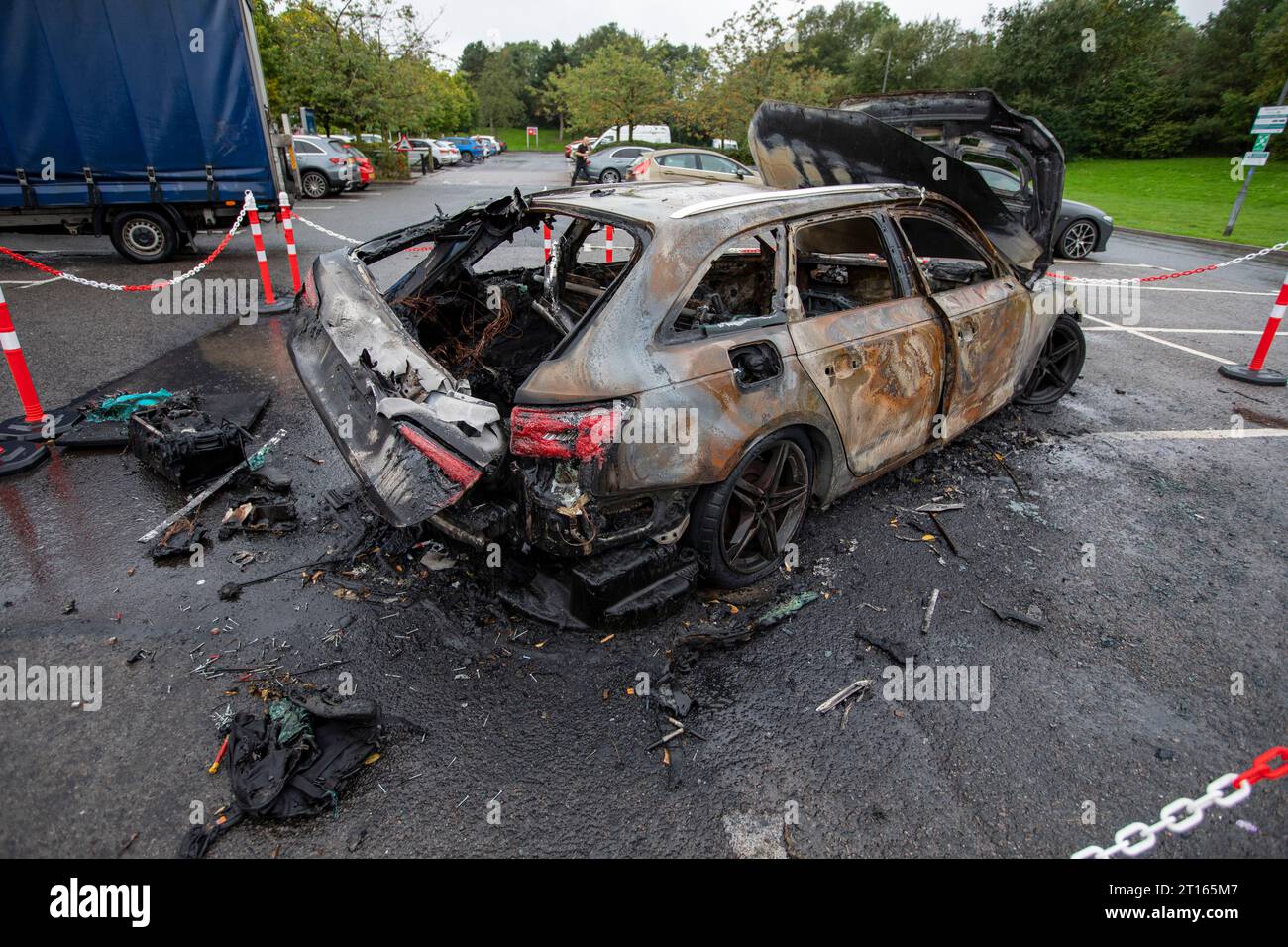 The burnt out shell of an Audi estate car at Tibshelf Service station ...