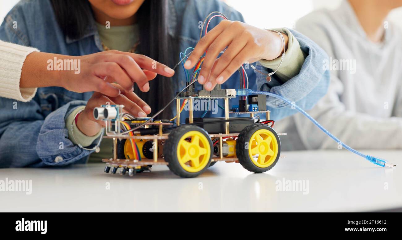 Technology, closeup and car robotics of students in classroom ...