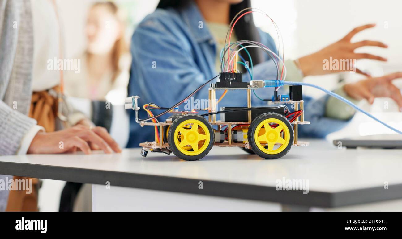 Hands, robotics classroom and students at school, learning or ...