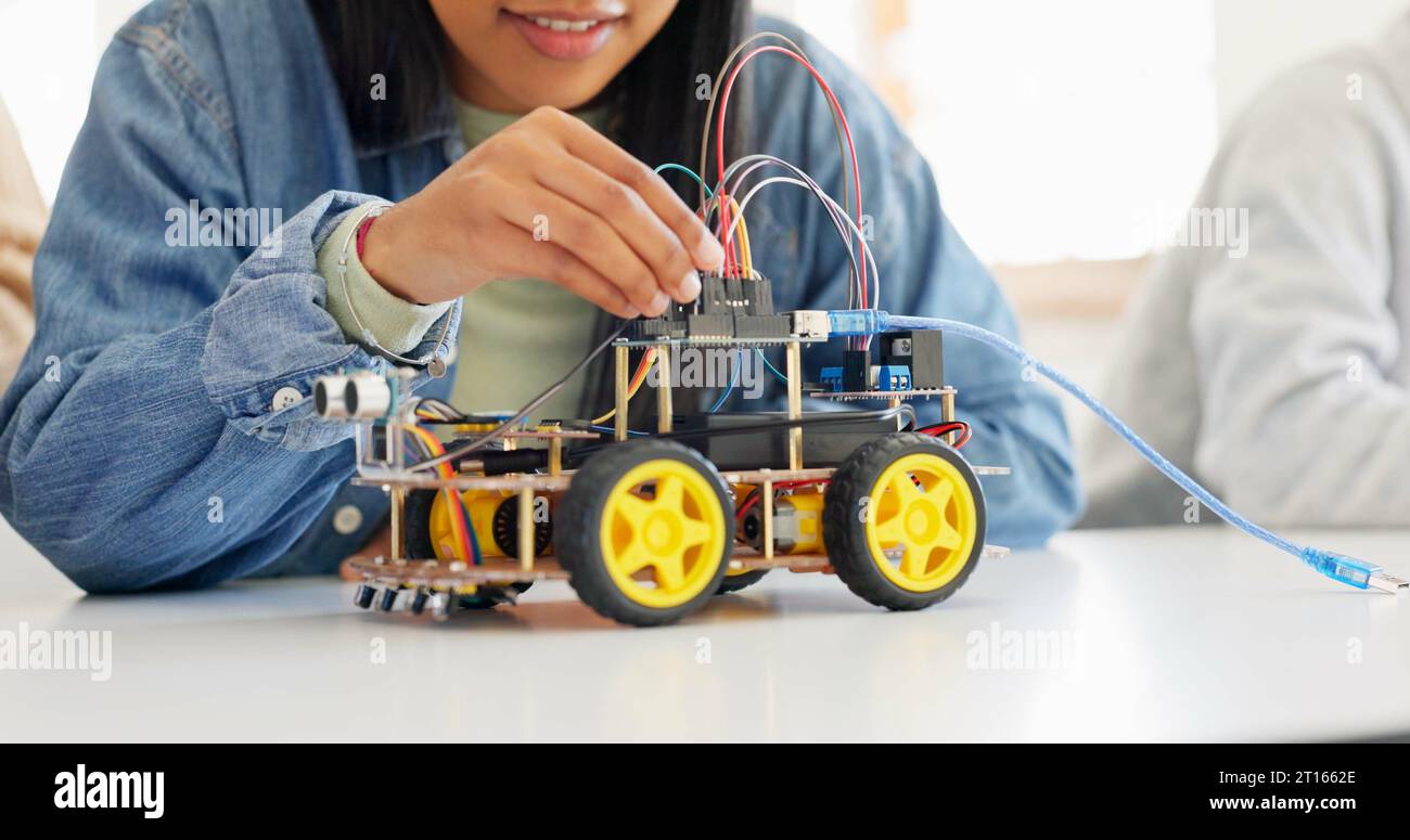 Technology, closeup and car robotics of students in classroom ...