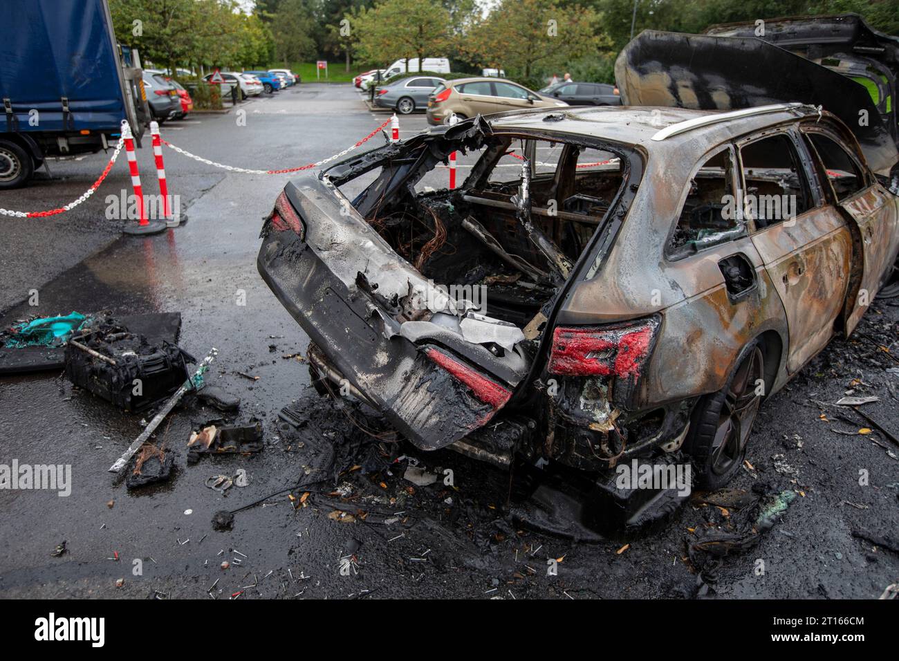 The burnt out shell of an Audi estate car at Tibshelf Service station ...