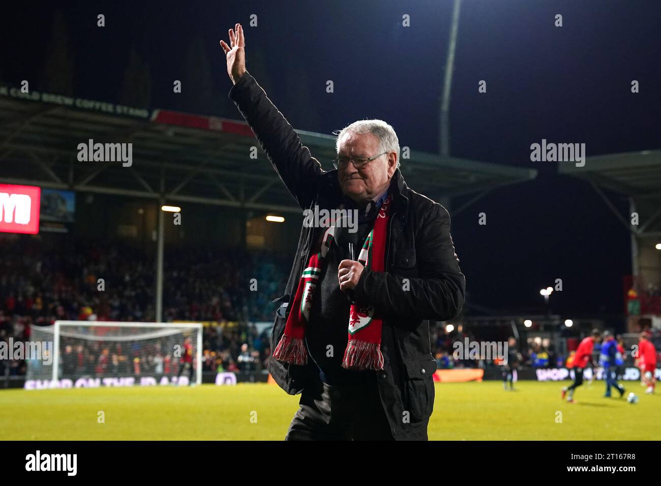 Welsh folk singer Dafydd Iwan acknowledges the crowd before an ...
