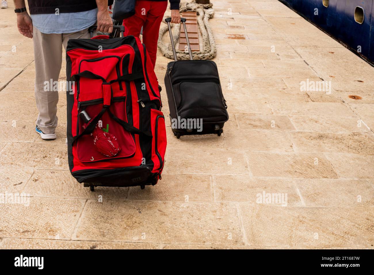 passengers carry suitcases along the pier to the liner. Refugees, war ...