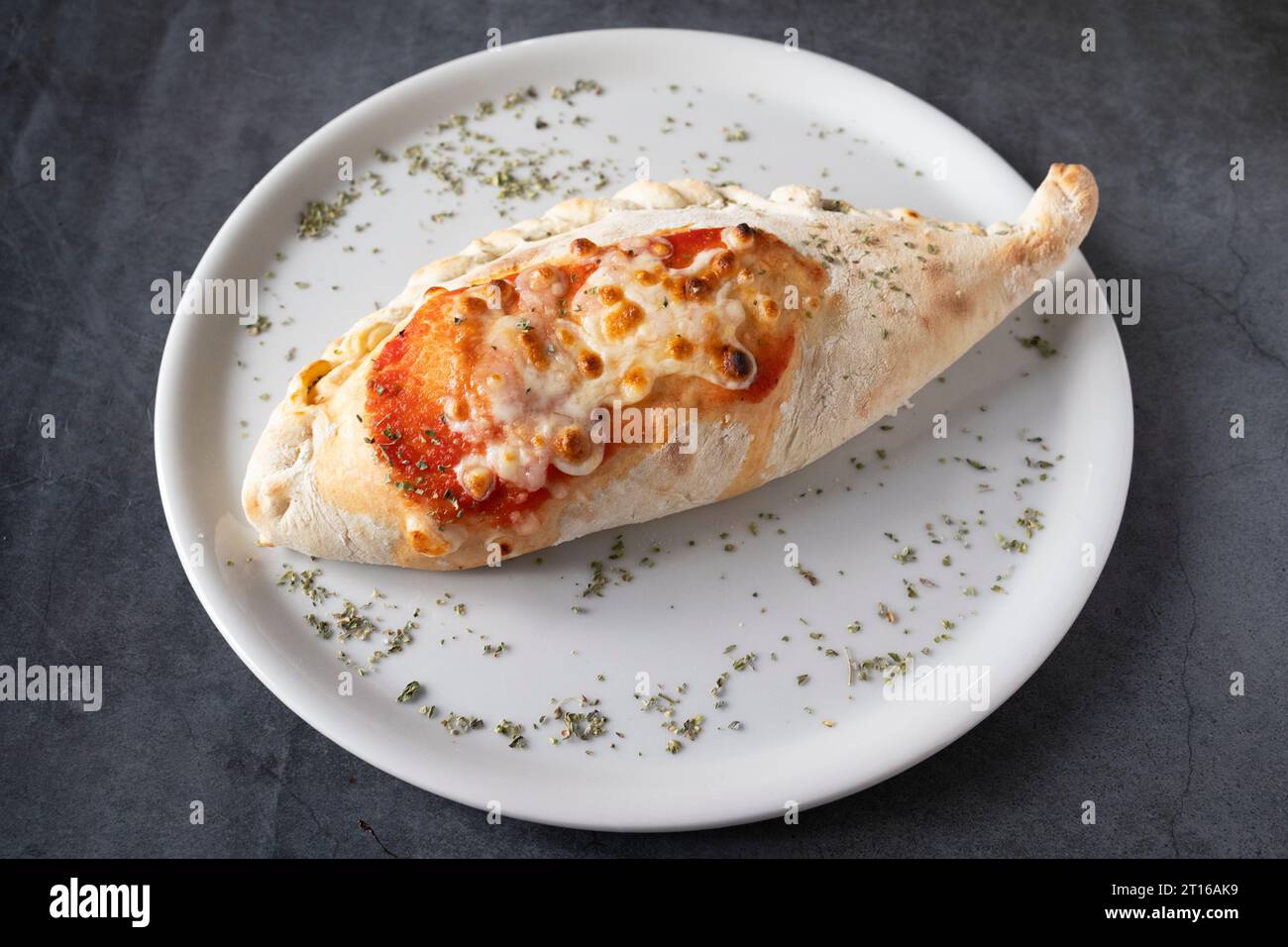 pizza calzone, typical dish of Italian cuisine Stock Photo - Alamy
