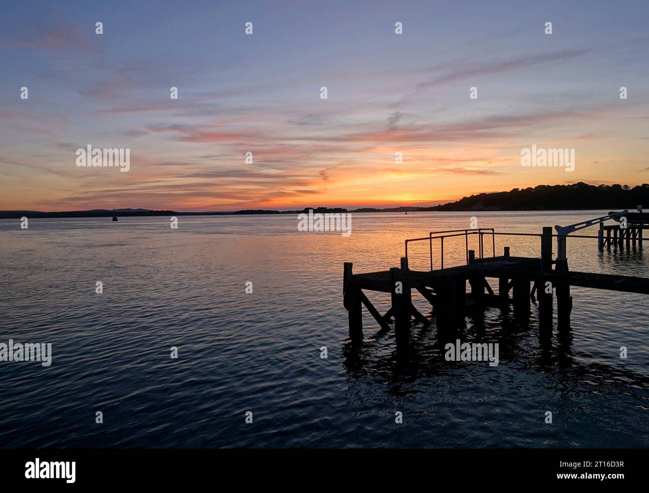 Photograph of a sunset over Poole Harbour in Southern England Stock ...