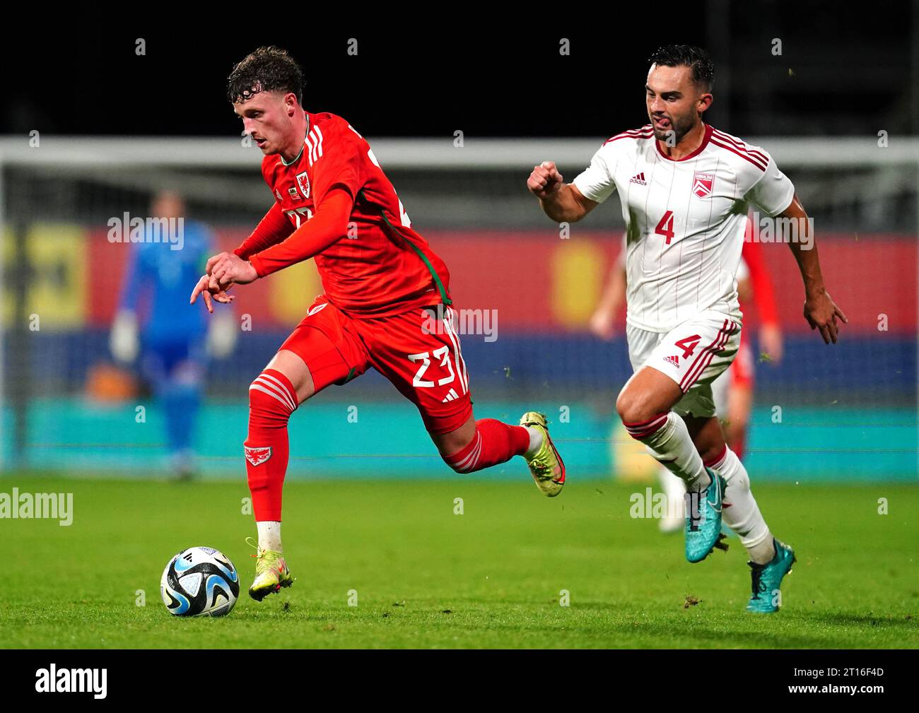 Wales' Nathan Broadhead (left) and Gibraltar's Jack Sergeant battle for ...