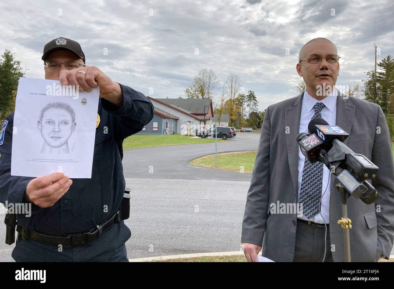 Castleton, Vt., Police Chief Peter Mantello, left, holds up a sketch of ...