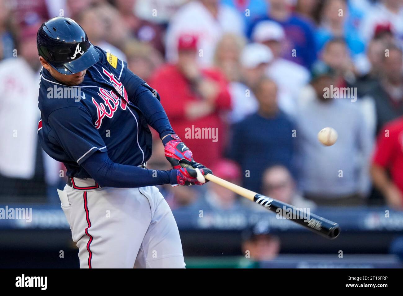 Atlanta Braves' Austin Riley hits a single during the first inning of Game 3 of a baseball NL ...