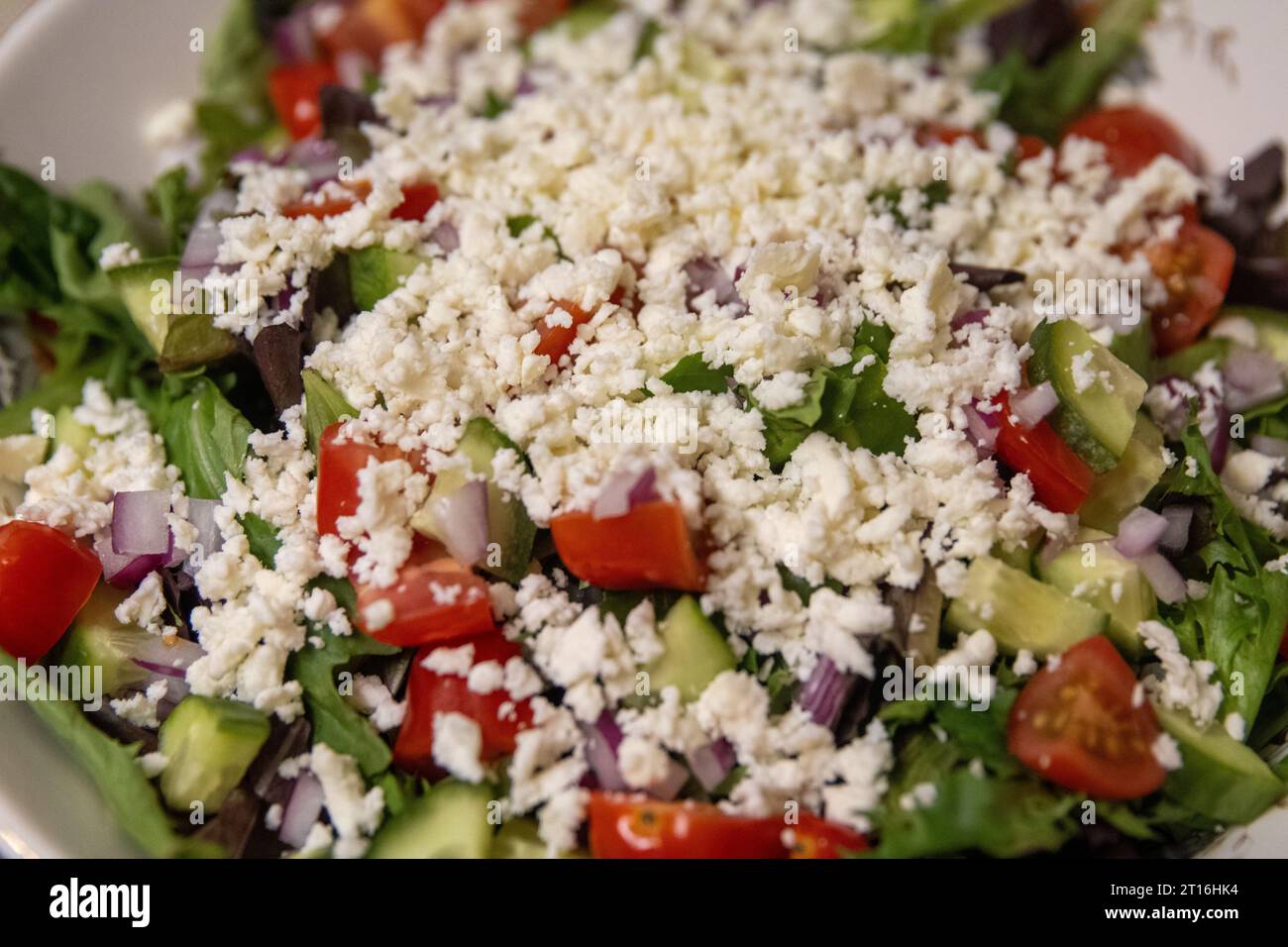 Spring Mix salad with feta cheese Stock Photo - Alamy