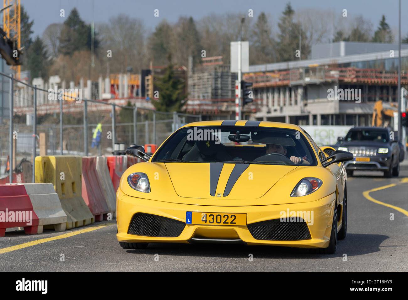 Yellow Ferrari 430 Scuderia driving on the road Stock Photo - Alamy