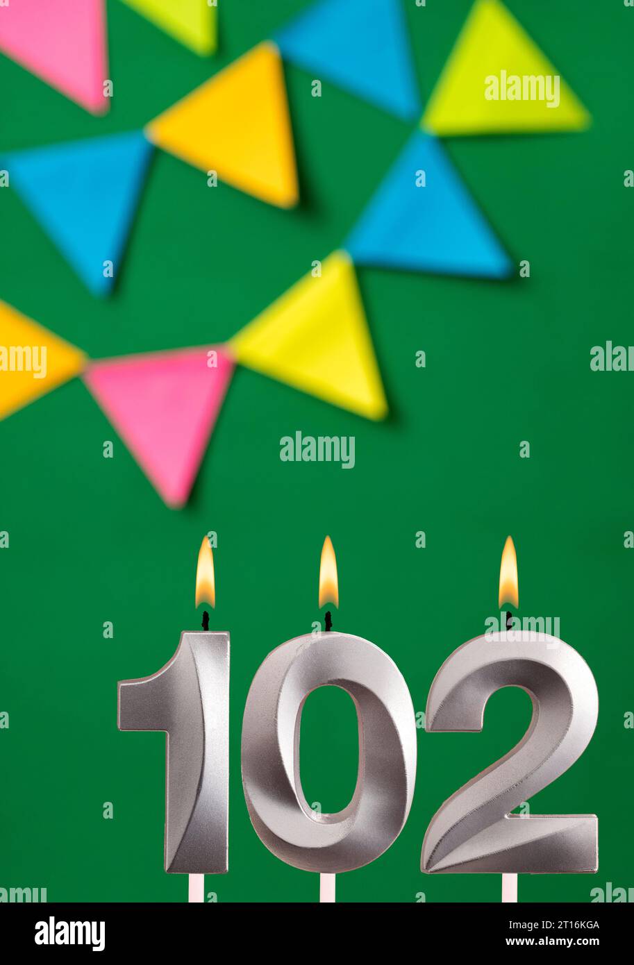 Vertical birthday card with number 102 candle - Green background with ...