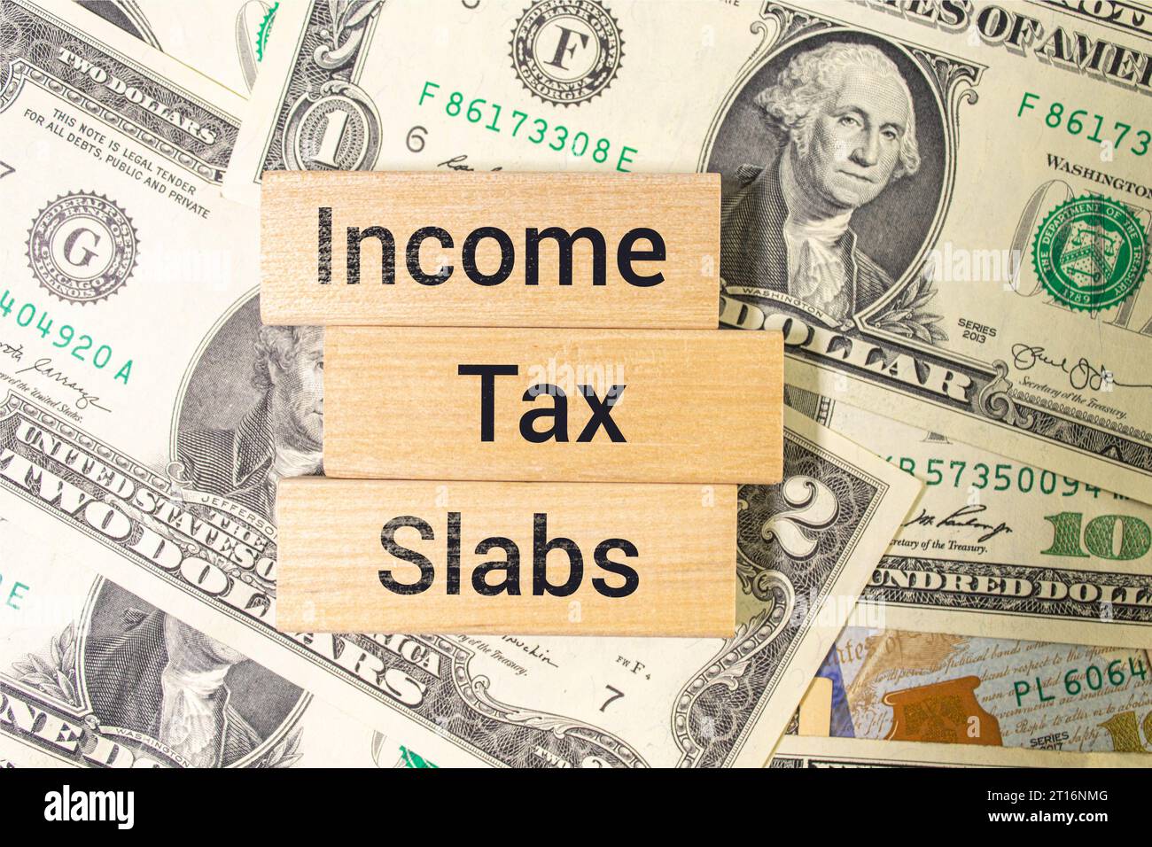 Income Tax Slabs inscription on white card. Workplace background, top ...