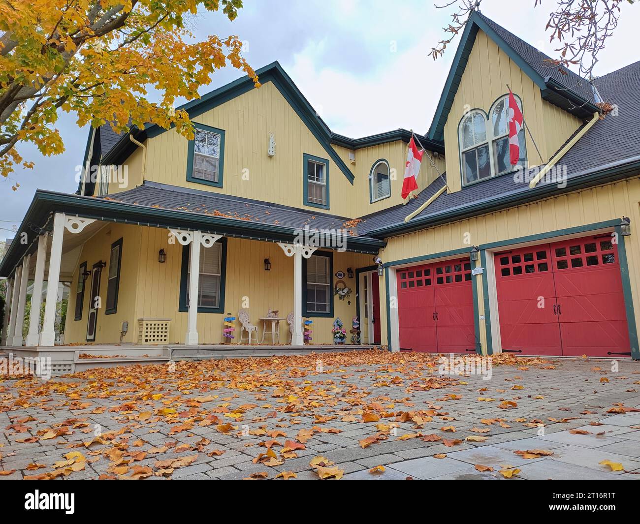 Victorian style house exterior with autumn leaf colour Stock Photo - Alamy