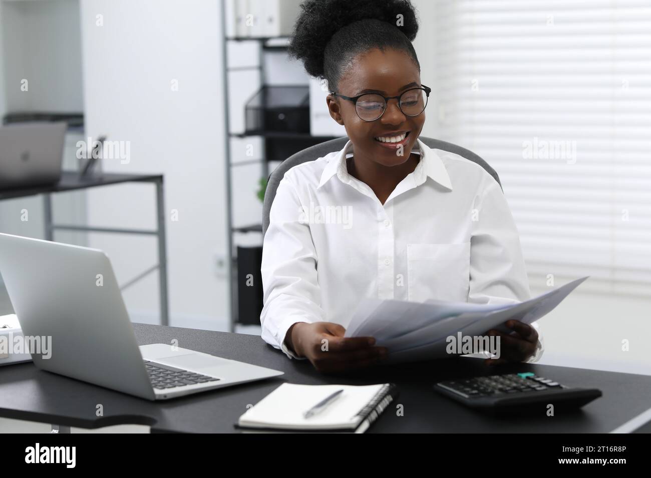 Professional accountant working at desk in office Stock Photo - Alamy