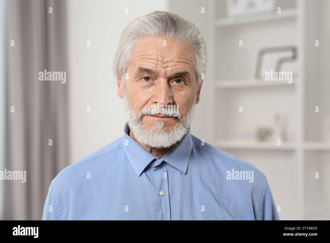 Portrait of handsome senior man at home Stock Photo - Alamy