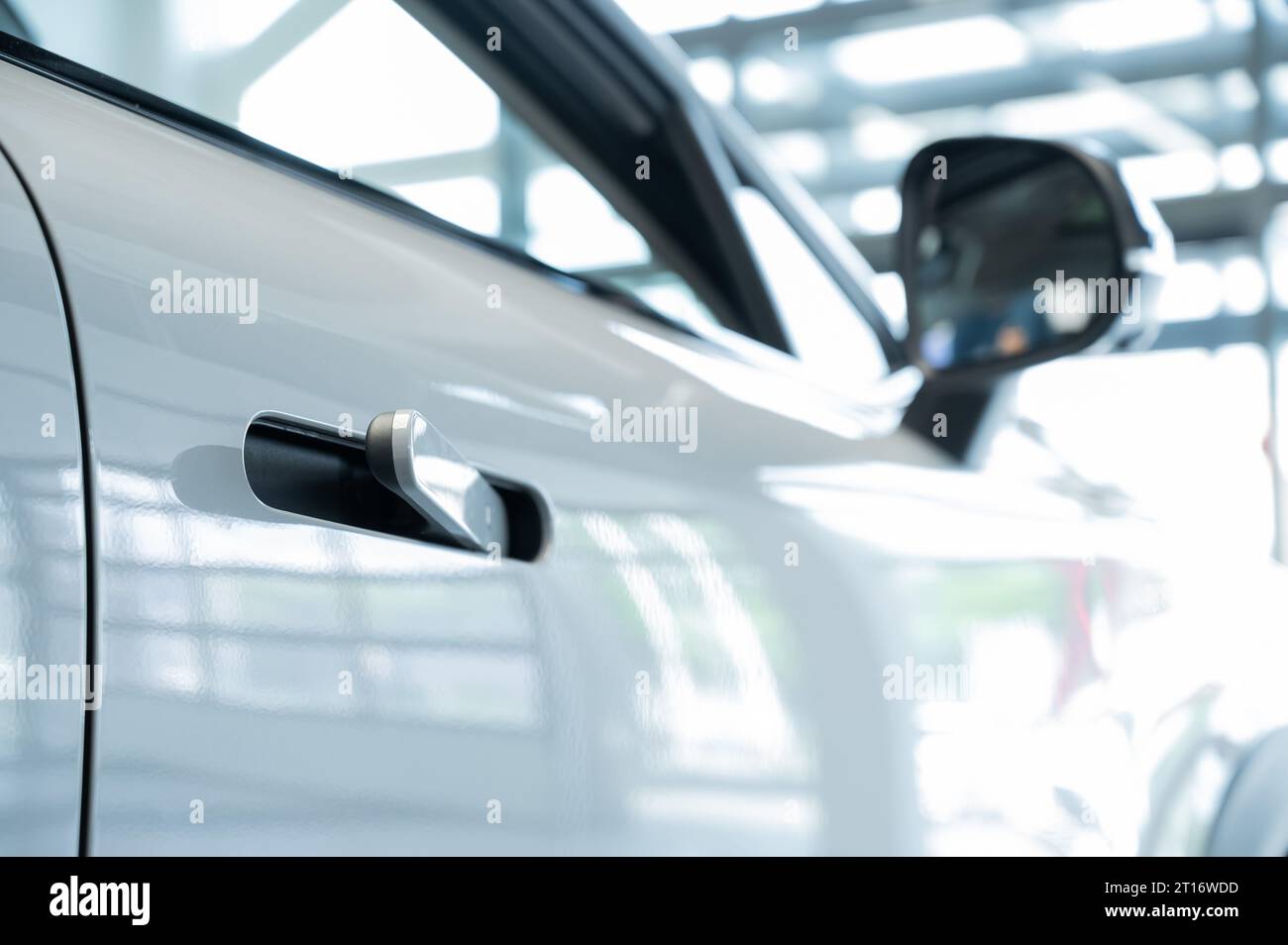 Close-up of an integrated handle in a car door. Fingerprint lock Stock ...