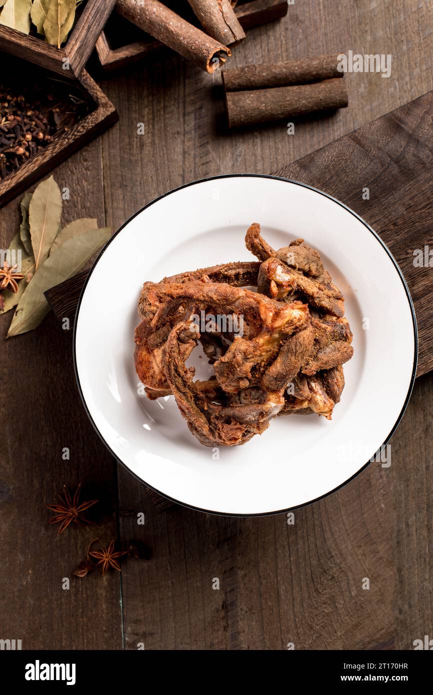 Marinated duck Clavicle bone in Spiced Sauce Stock Photo - Alamy