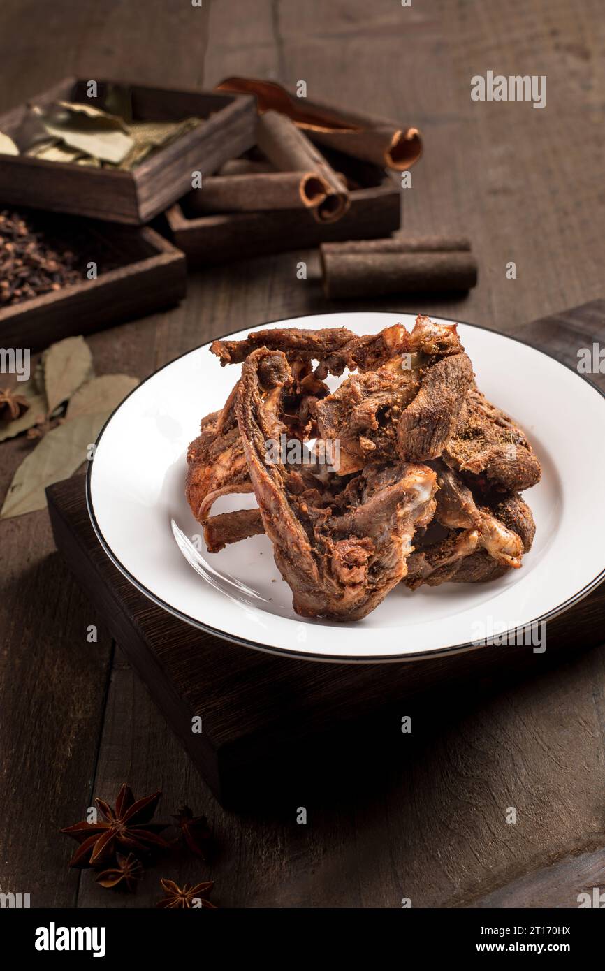 Marinated duck Clavicle bone in Spiced Sauce Stock Photo - Alamy