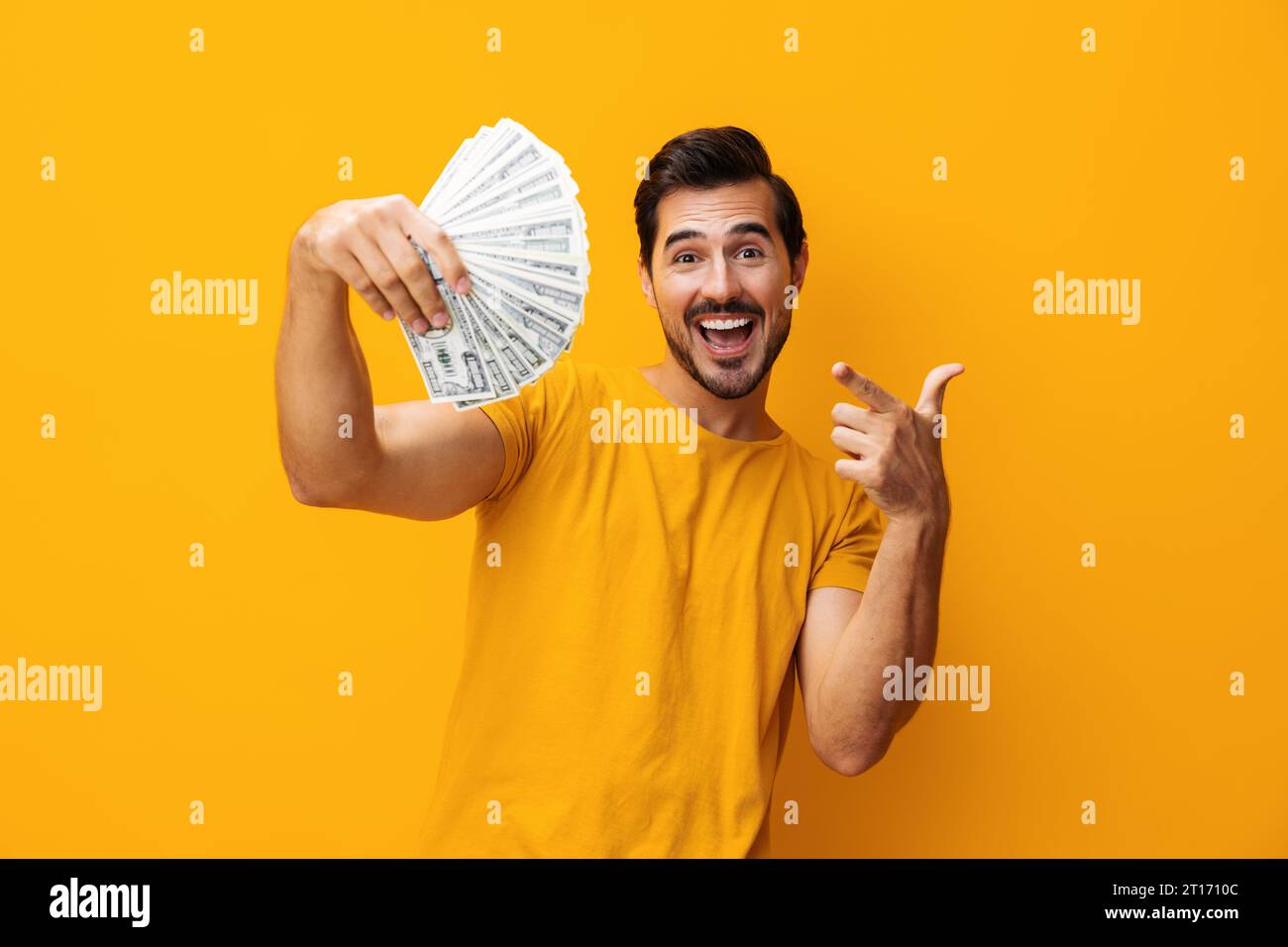 Smiling man cash currency happy yellow money hand dollar background ...