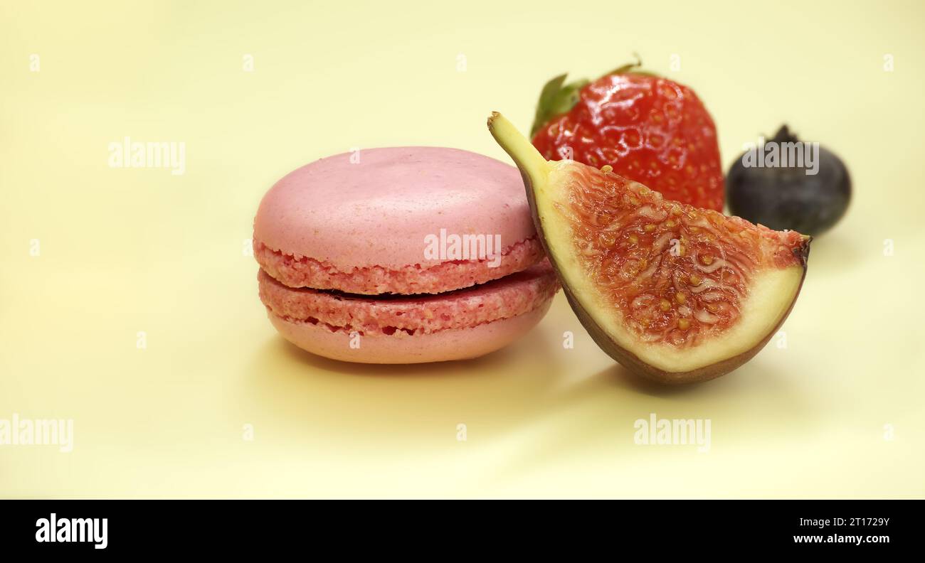 Vibrant scene of a table filled with macaroons and fruits contrast ...