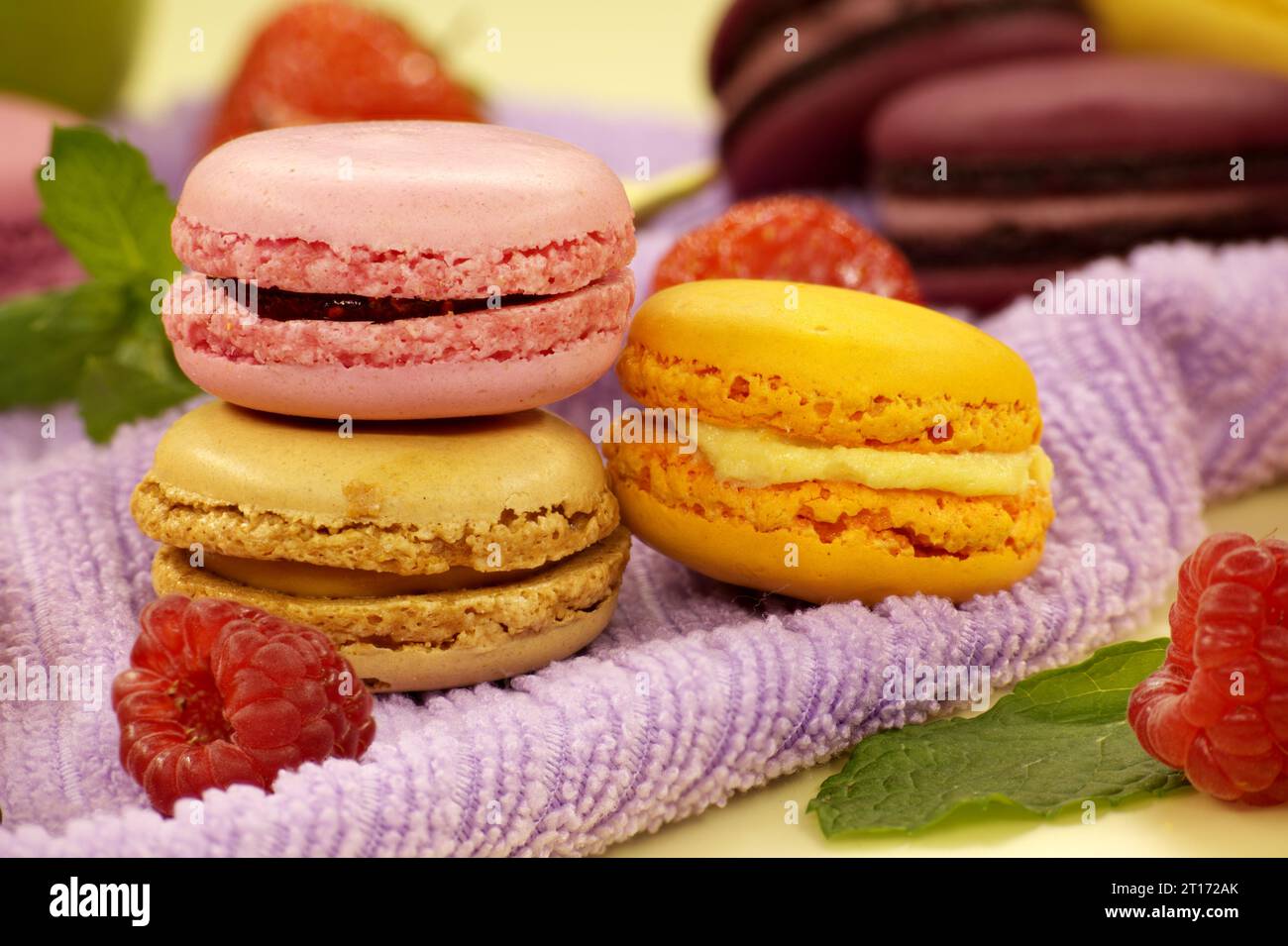 Table filled with macaroons and fruits visual appeal of the food joy of ...