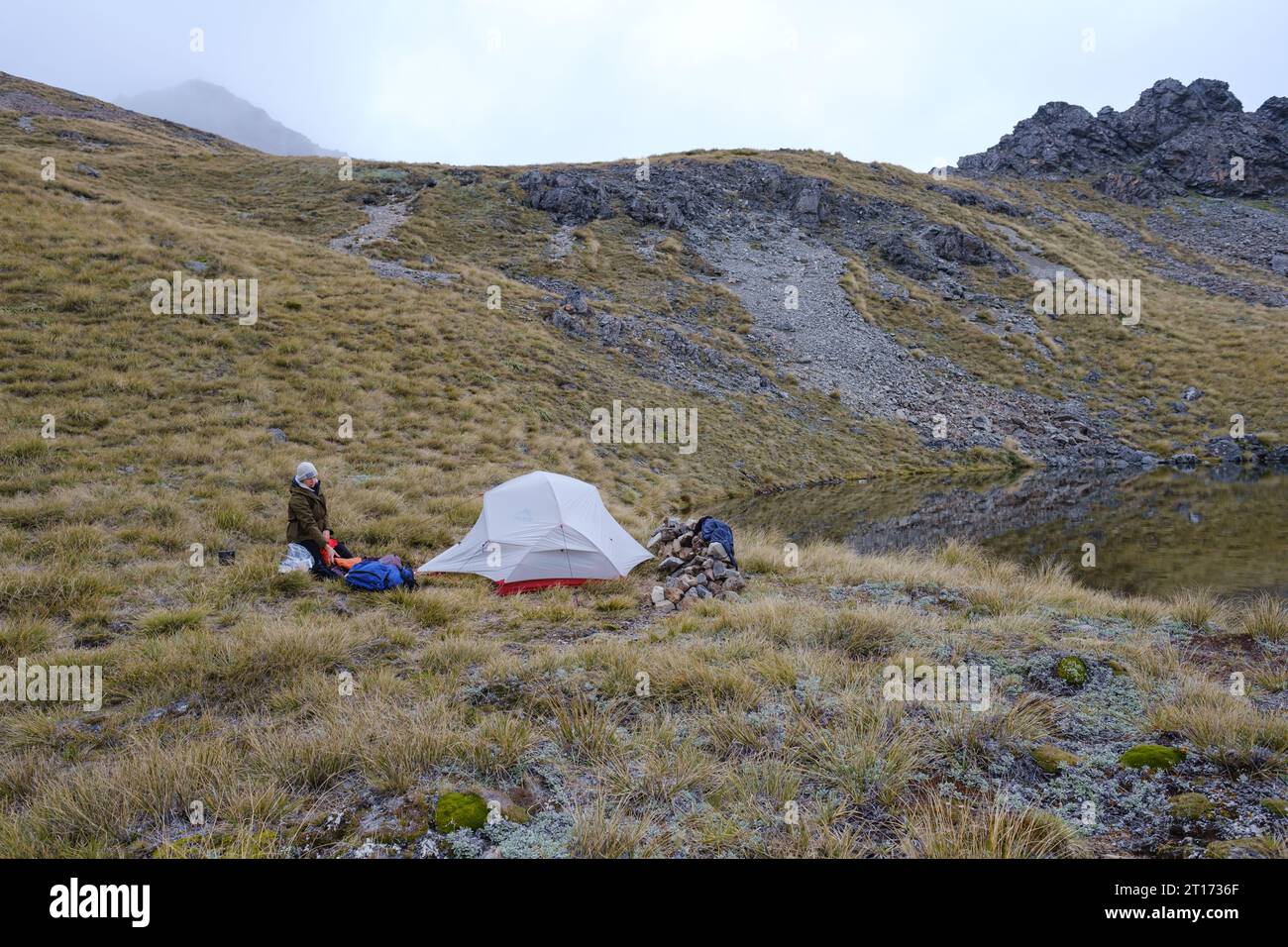 Campsite high in the mountains of the southern alps above the tree line ...