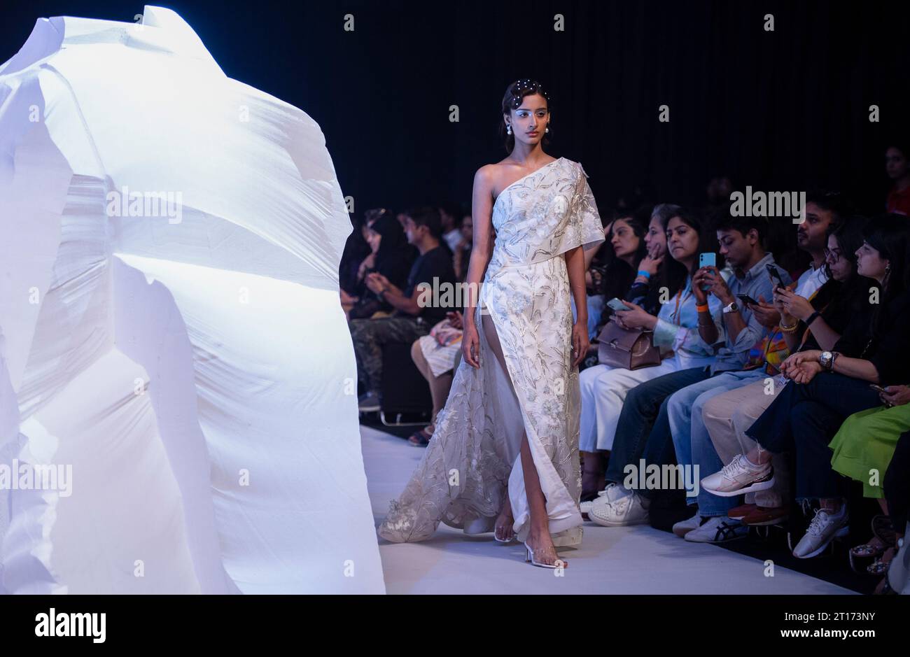 New Delhi, India. 11th Oct, 2023. A model displays a creation of Indian ...