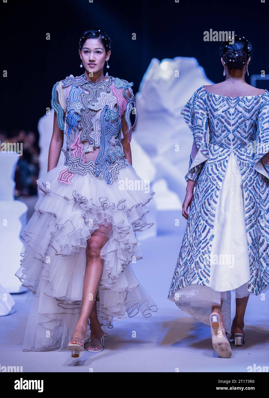 New Delhi, India. 11th Oct, 2023. Models display creations of Indian ...