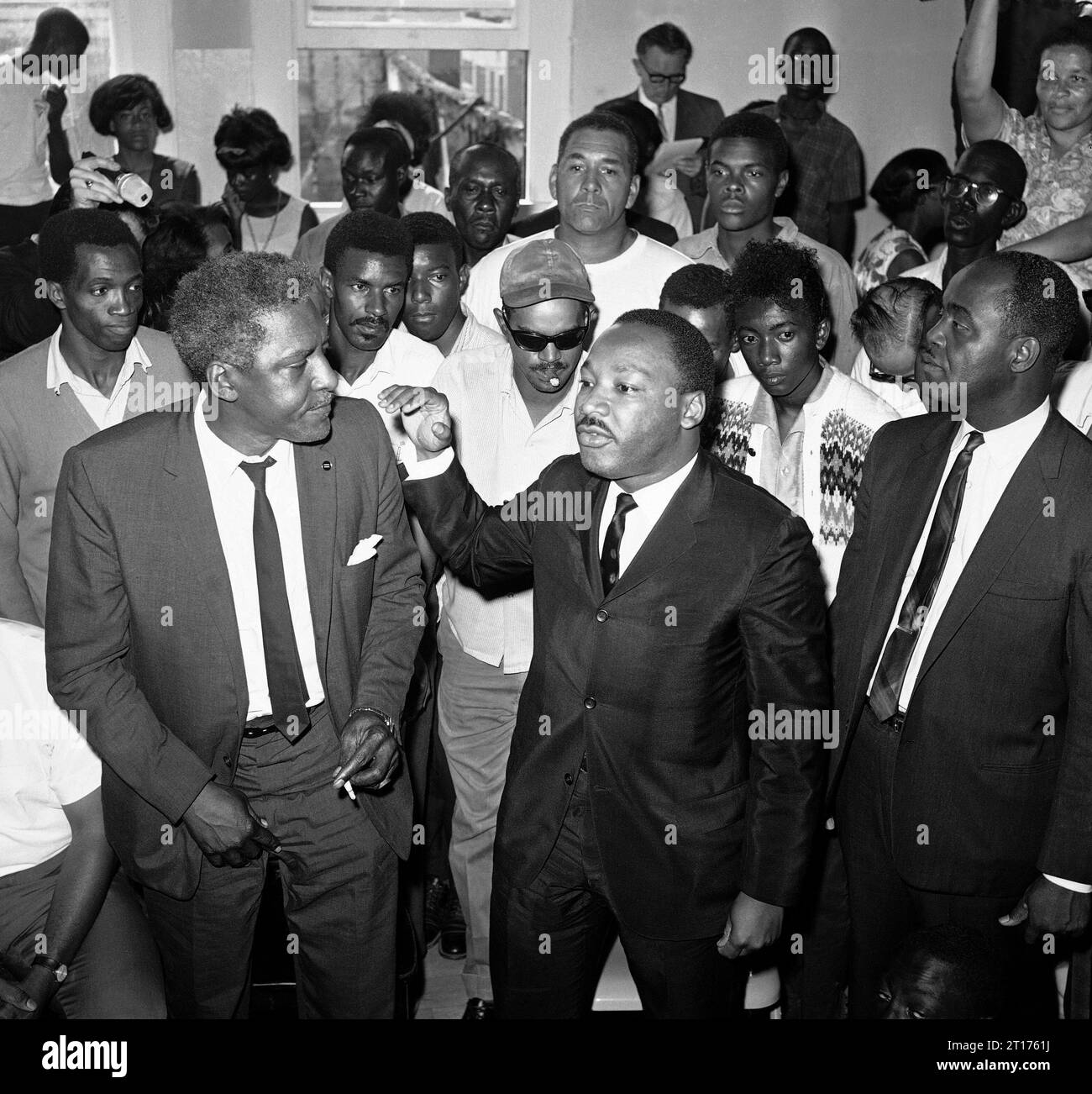 FILE - Dr. Martin Luther King Jr., center, addresses a gathering in the ...