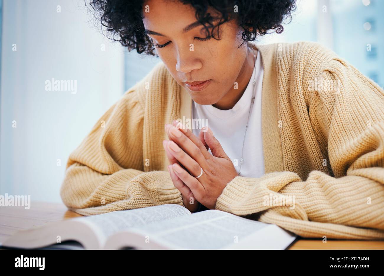 Bible, praying and woman in home for religion, Christian worship or ...