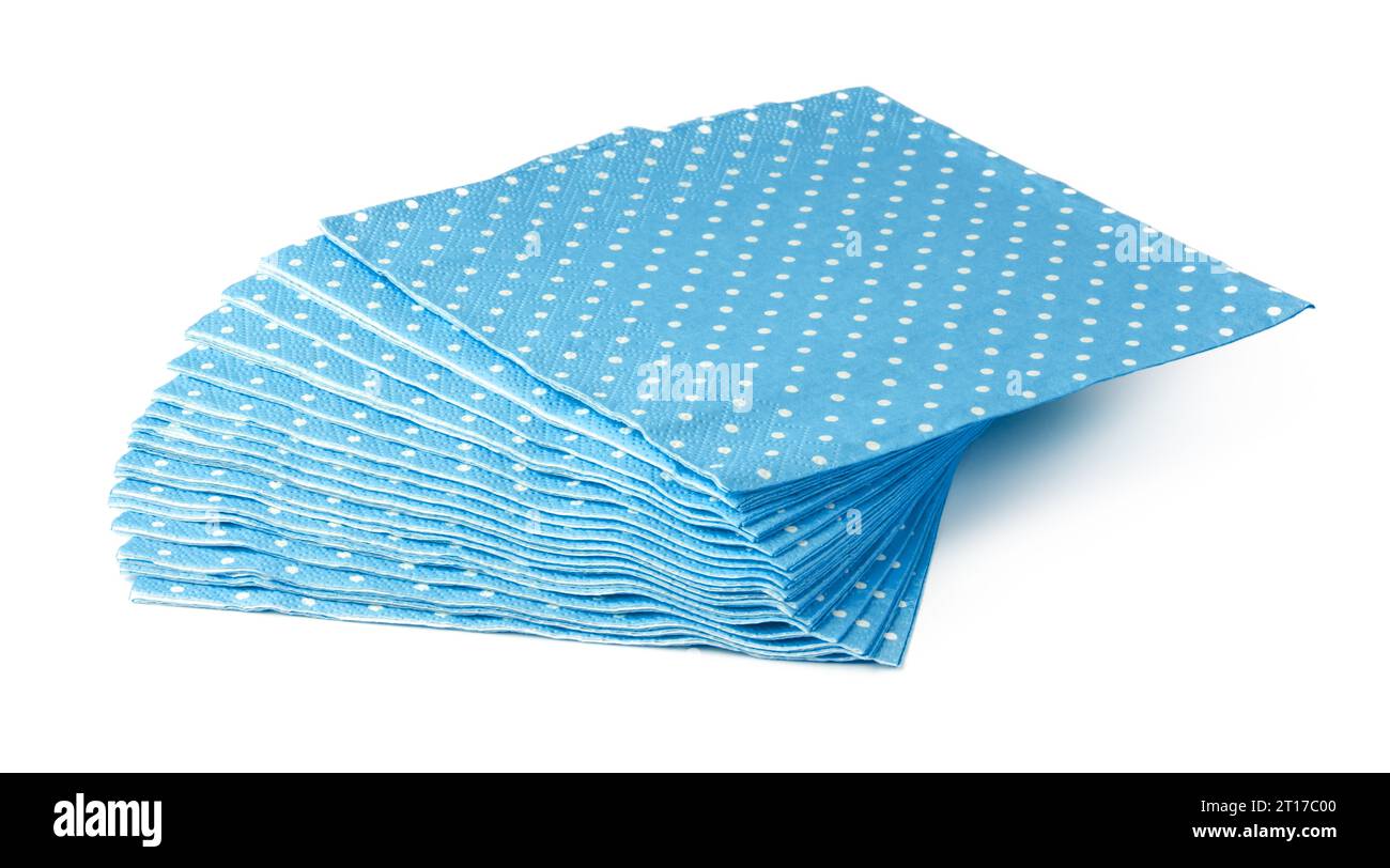 Stack of blue dotted paper napkins isolated on white Stock Photo - Alamy