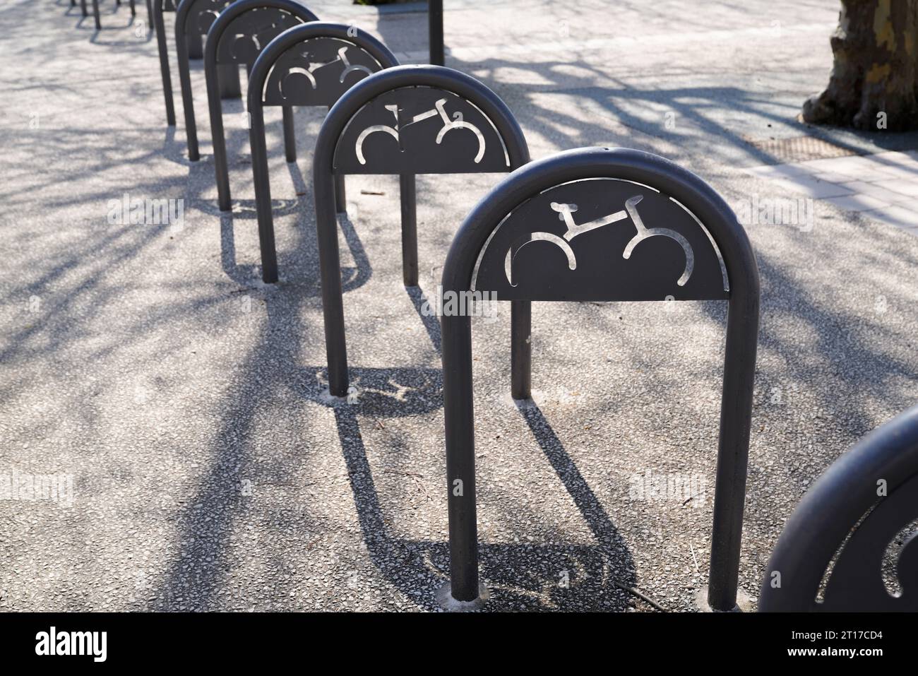 Empty bike parking in city park space for multiple bikes bicycles in ...