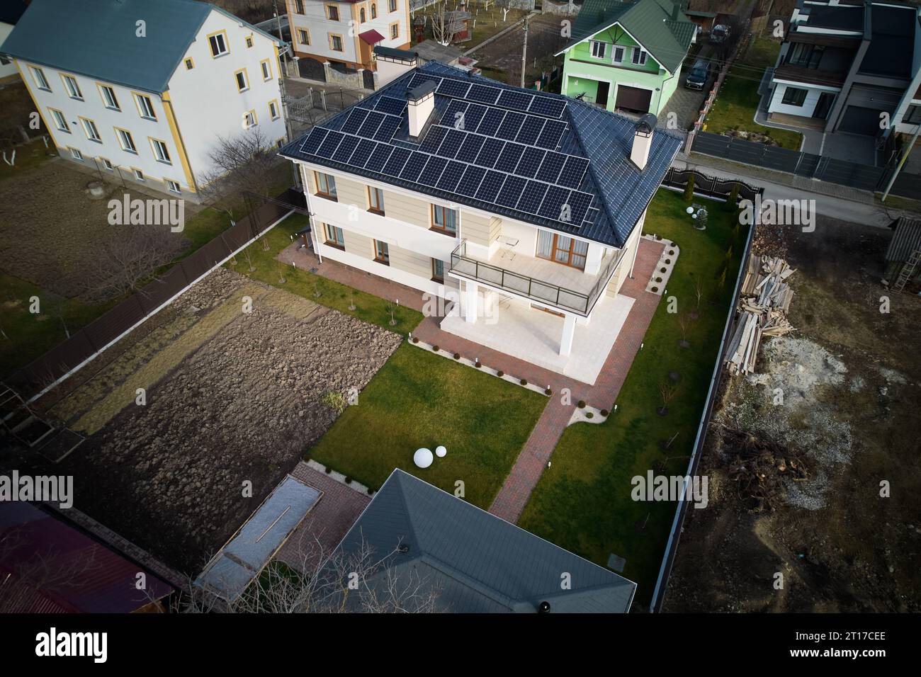 Aerial drone view of house with photovoltaic solar panels on rooftop ...