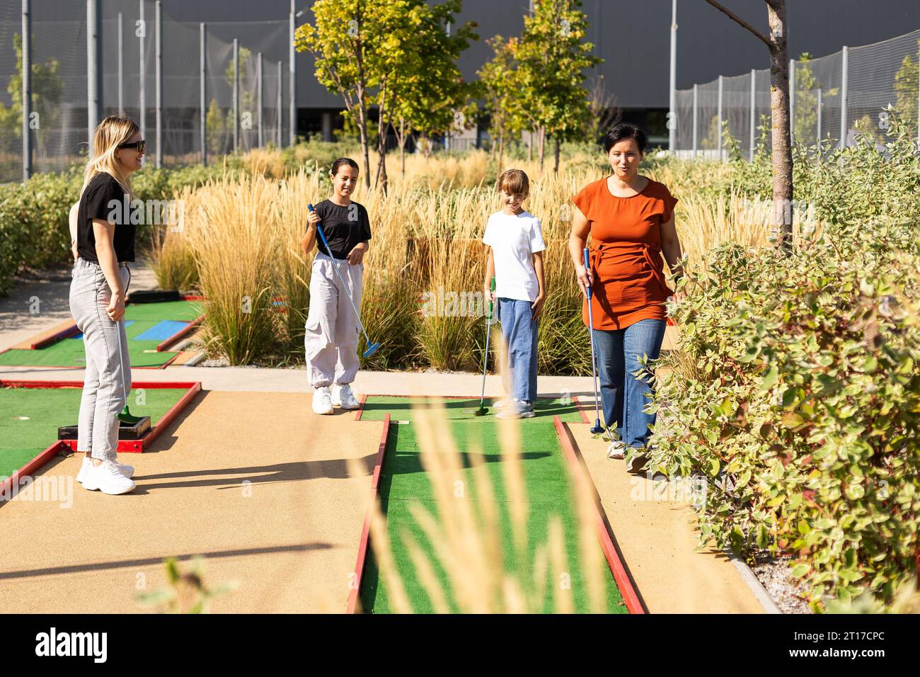 Golf course group of friends people with children posing standing Stock ...