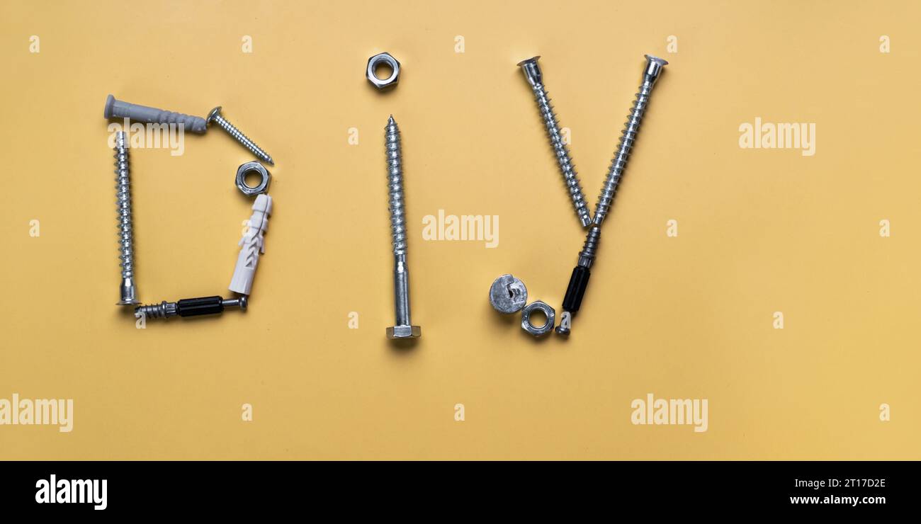 Sign DIY, frame with copy space made of bolts, screws. Banner on yellow ...