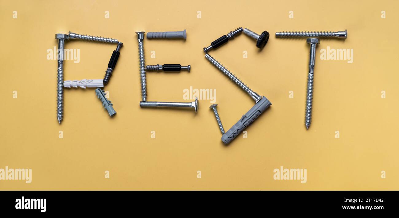 Sign Rest, frame with copy space made of bolts, screws. Banner on ...