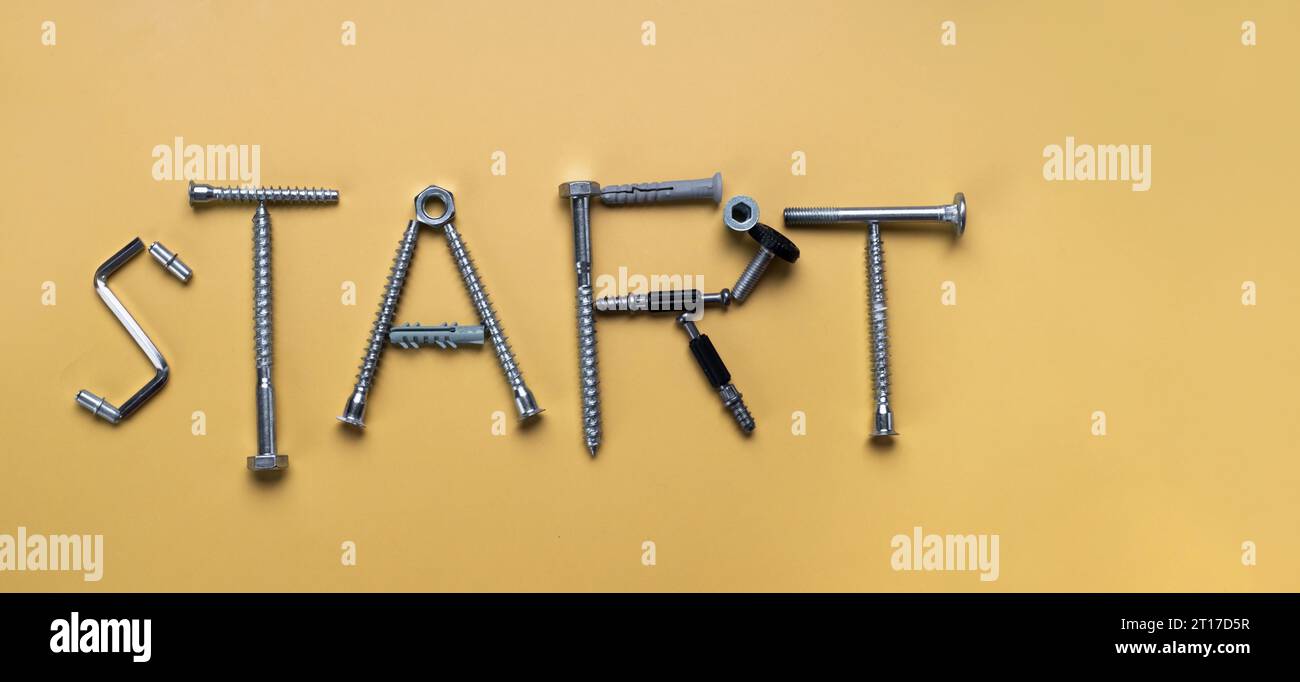 Sign Start, frame with copy space made of bolts, screws. Banner on ...