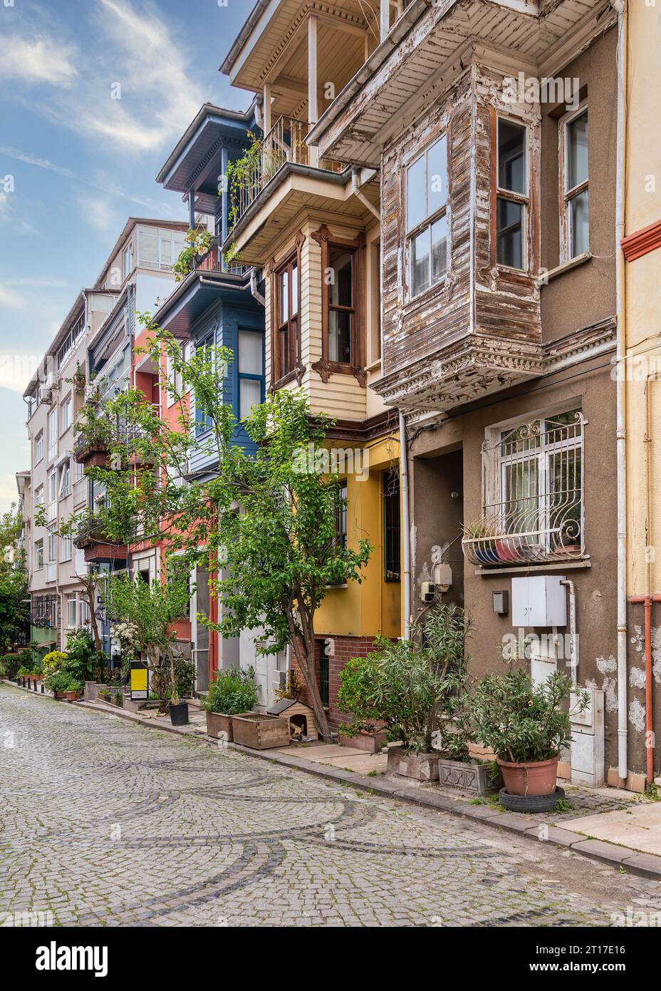 Narrow cobblestone alley with colorful wooden houses, suited in ...