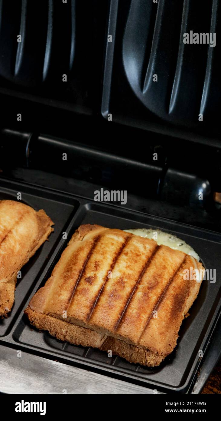 croque monsieur cooking in a croque monsieur maker Stock Photo - Alamy