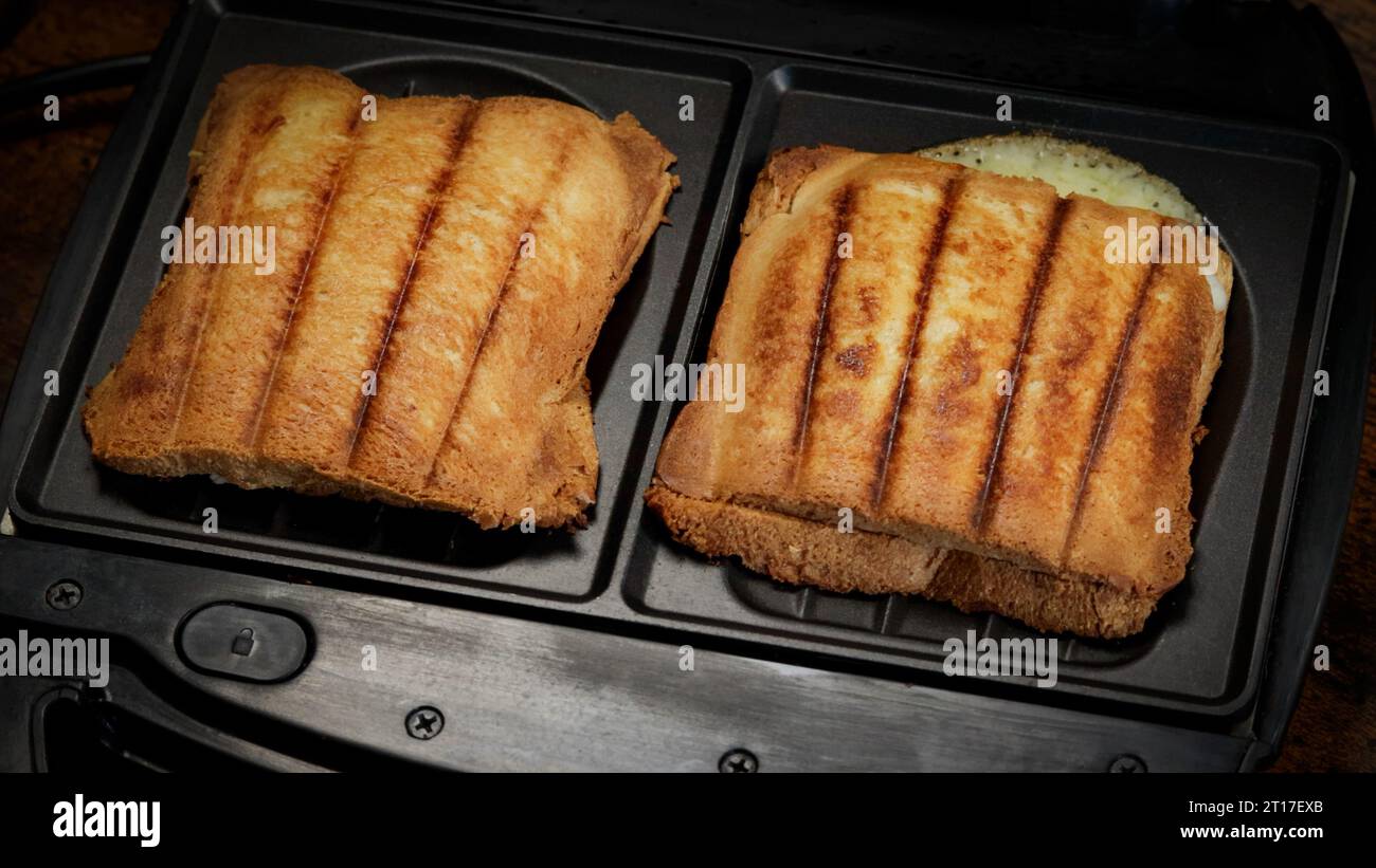croque monsieur cooking in a croque monsieur maker Stock Photo - Alamy