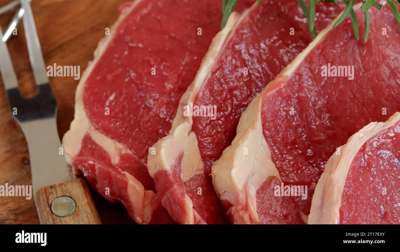 raw beef ribeye close-up on a cutting board Stock Photo - Alamy