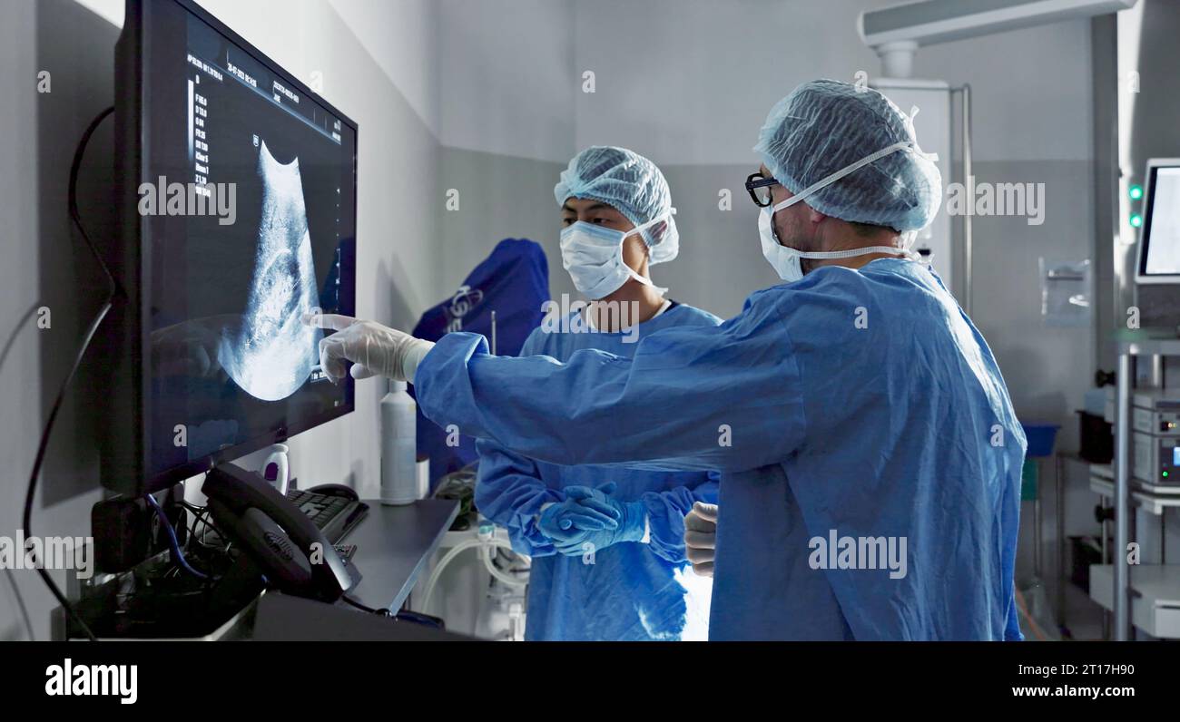 Surgery, x ray and a team of doctors in the hospital for an operation ...